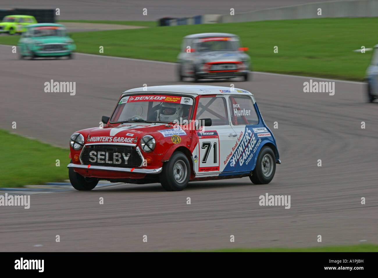 Mini Racing Cars racing around a circuit Stock Photo - Alamy