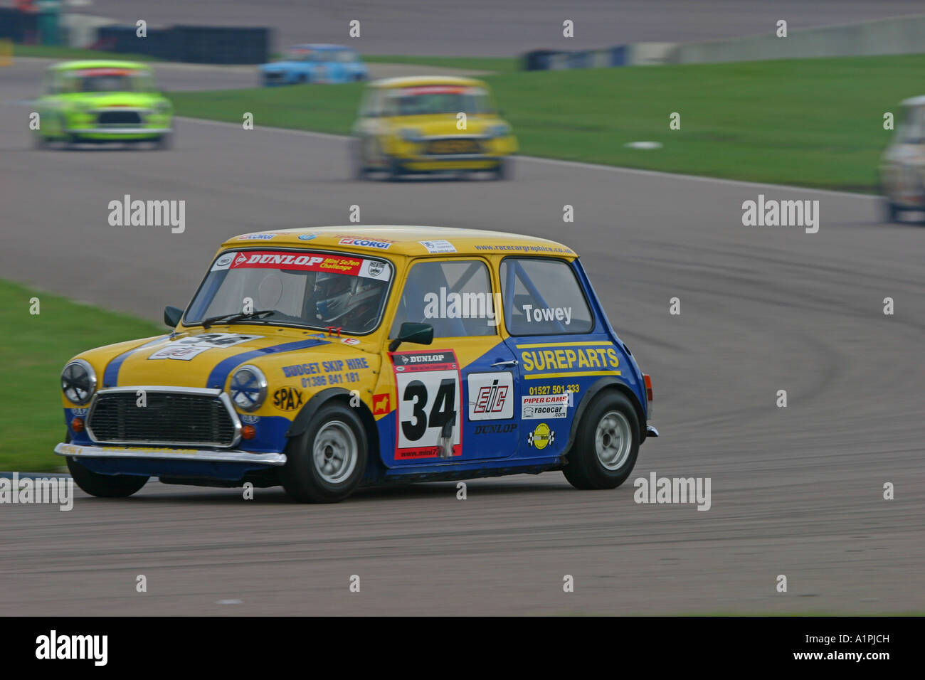 Mini Racing Cars racing around a circuit Stock Photo - Alamy