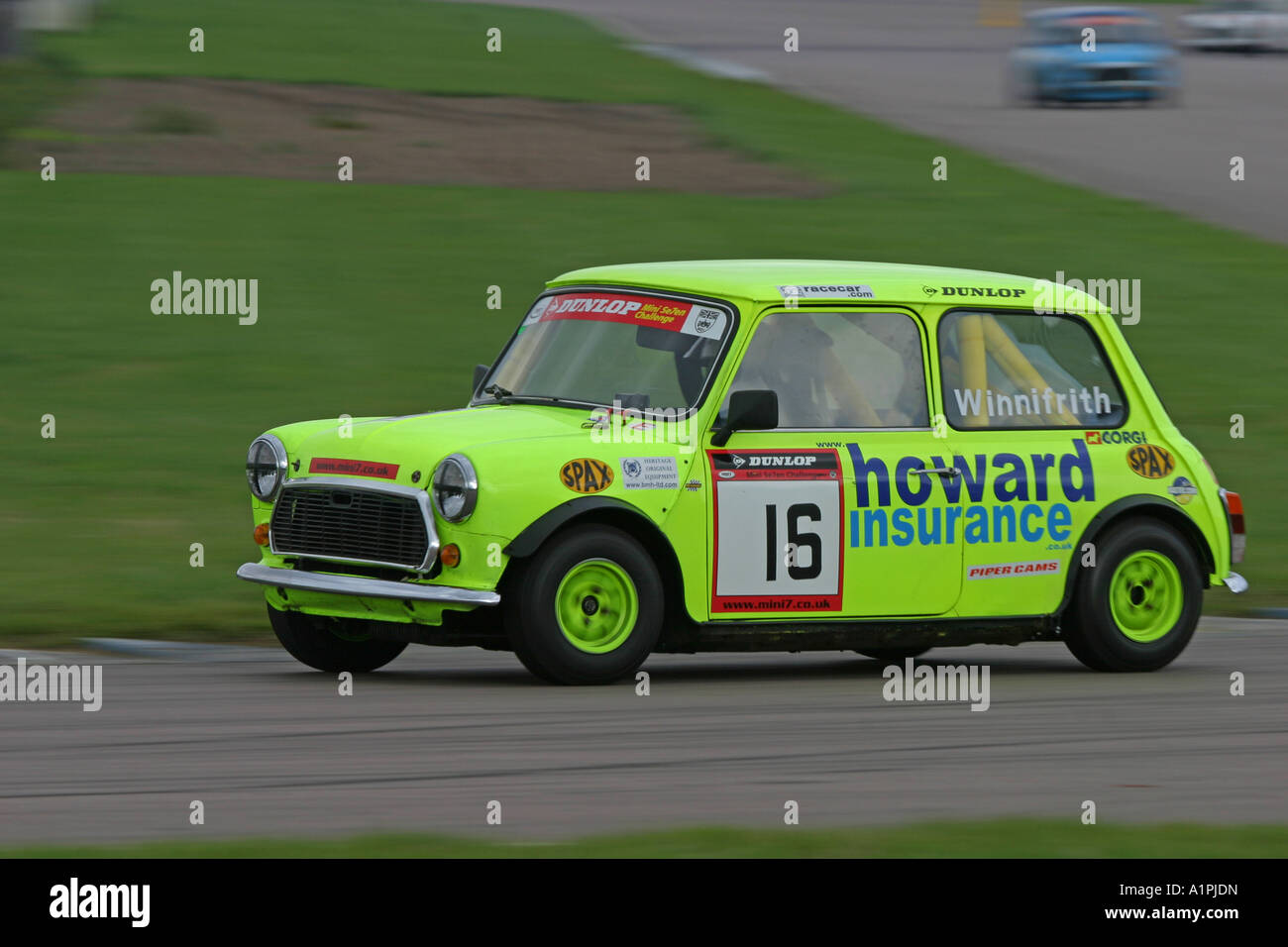 Mini Racing Cars racing around a circuit Stock Photo - Alamy