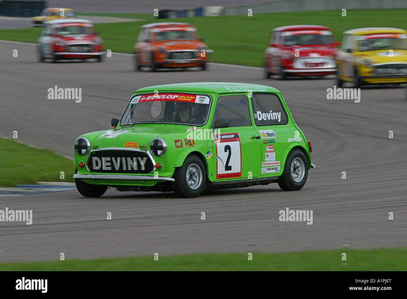 Mini Racing Cars racing around a circuit Stock Photo - Alamy