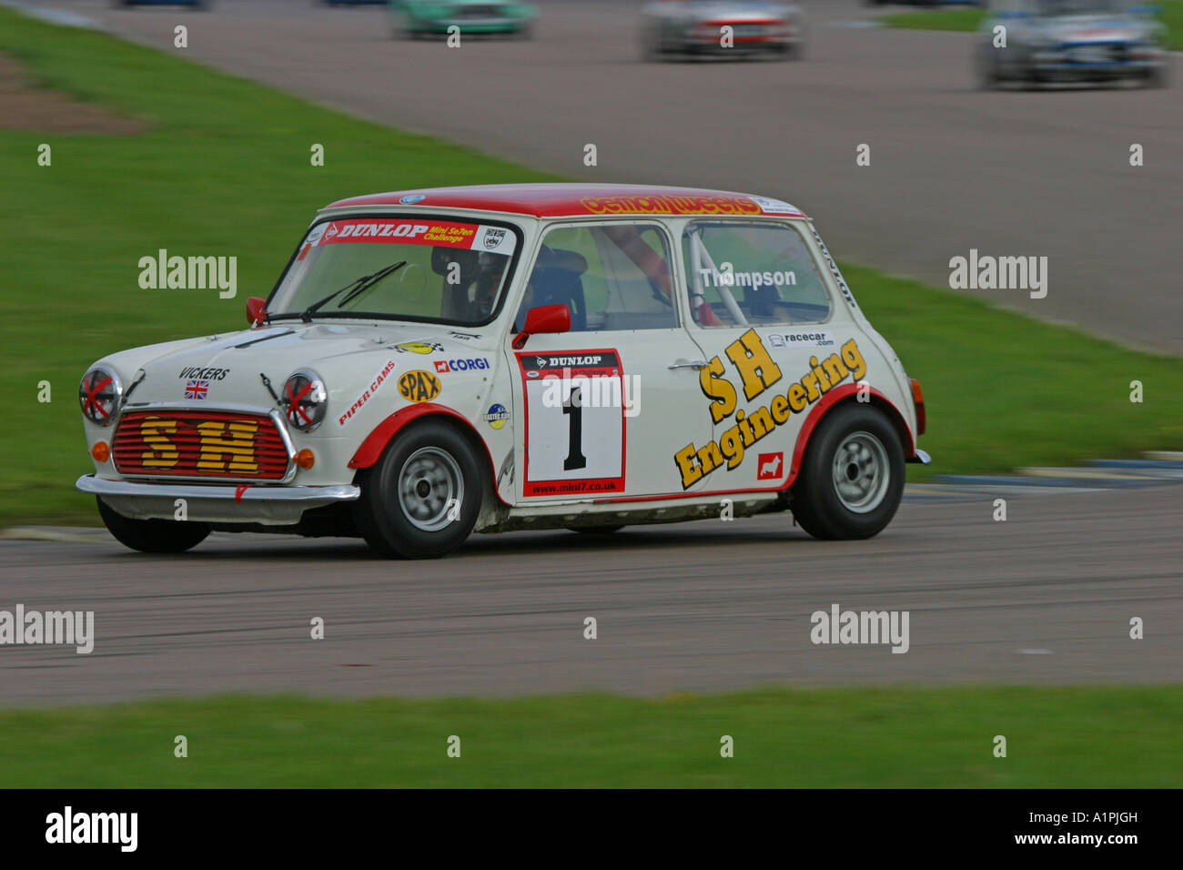 Mini Racing Cars racing around a circuit Stock Photo - Alamy