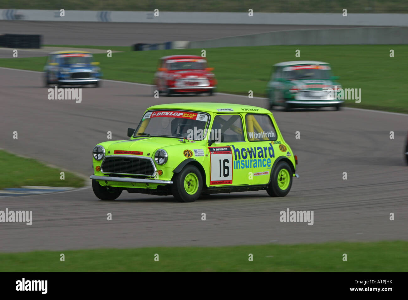 Mini Racing Cars racing around a circuit Stock Photo - Alamy