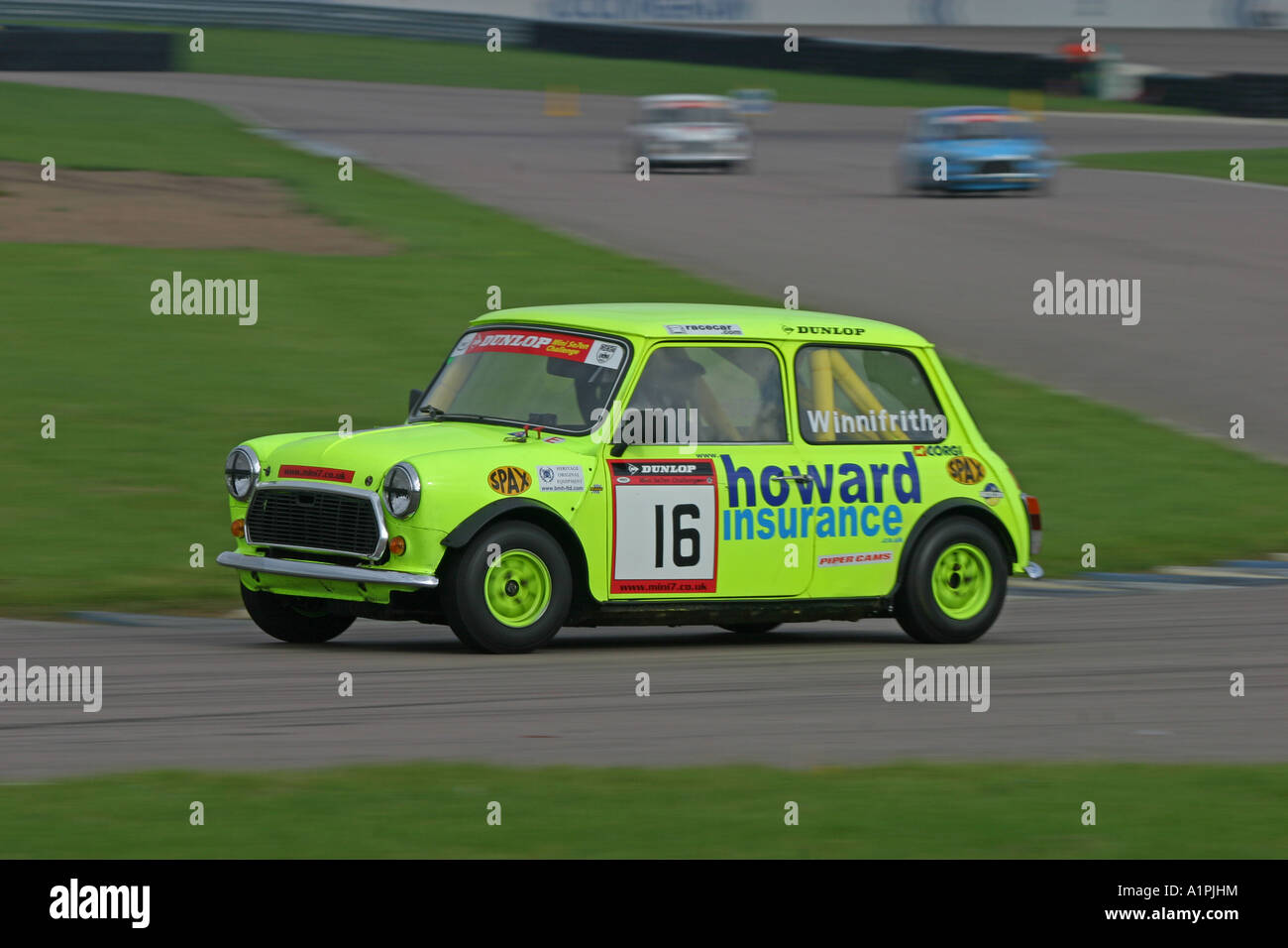 Mini Racing Cars racing around a circuit Stock Photo - Alamy