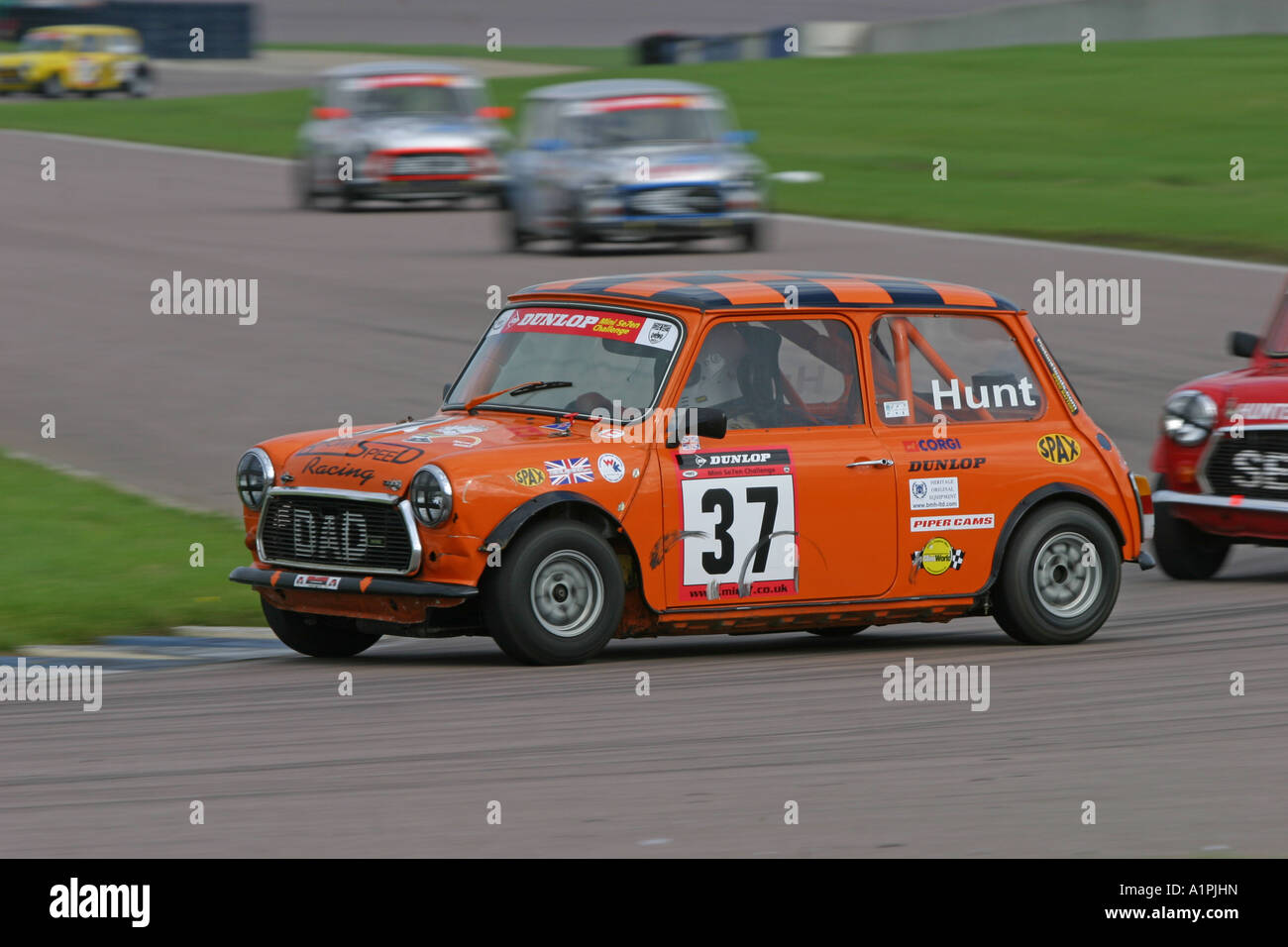 Mini Racing Cars racing around a circuit Stock Photo - Alamy