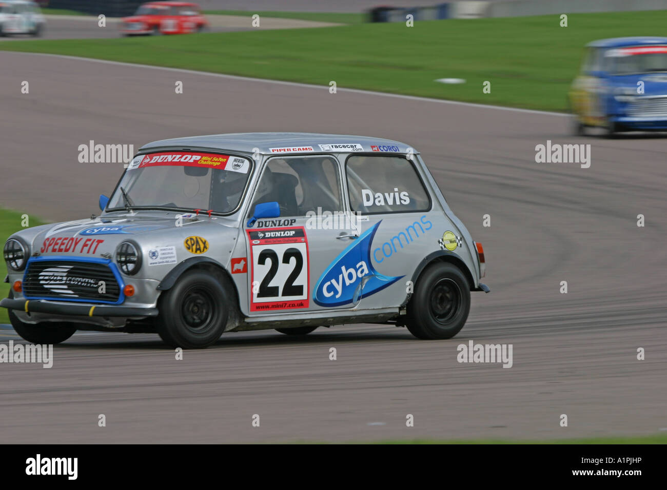 Mini Racing Cars racing around a circuit Stock Photo - Alamy