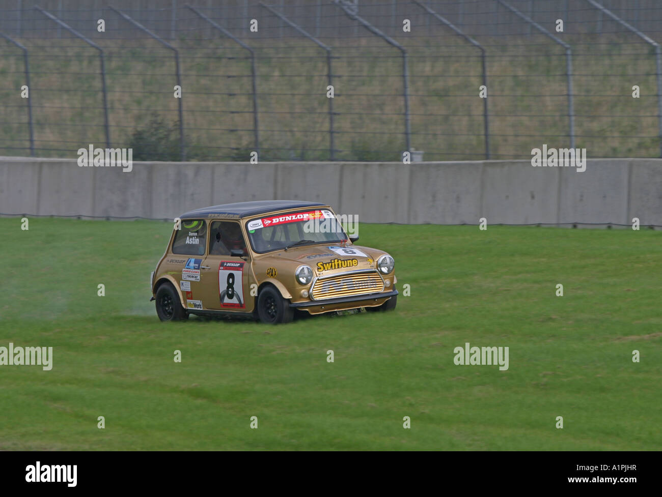 Mini Racing Cars racing around a circuit Stock Photo - Alamy