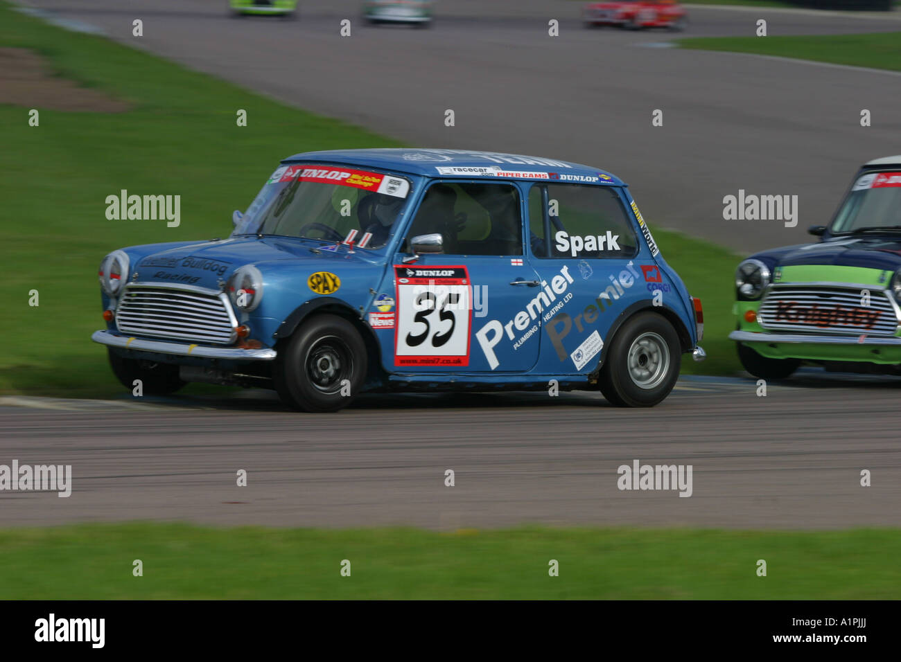 Mini Racing Cars racing around a circuit Stock Photo - Alamy