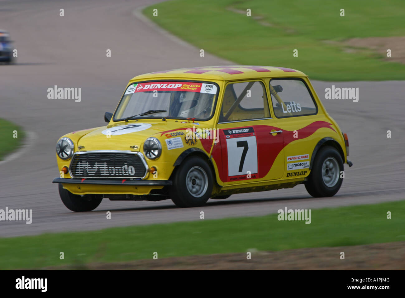 Mini Racing Cars racing around a circuit Stock Photo - Alamy