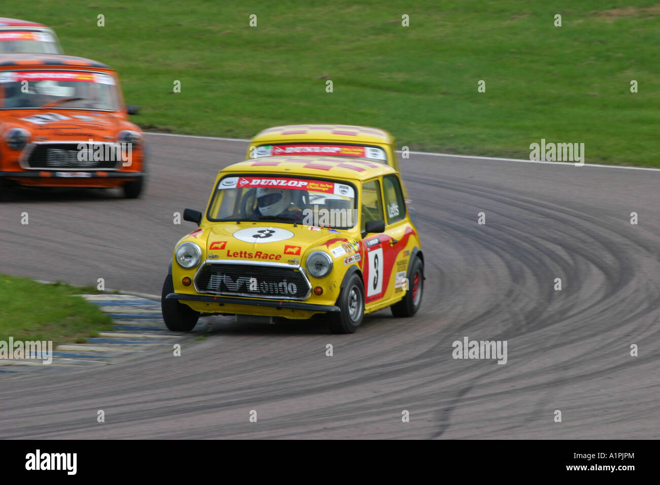 Mini Racing Cars racing around a circuit Stock Photo - Alamy