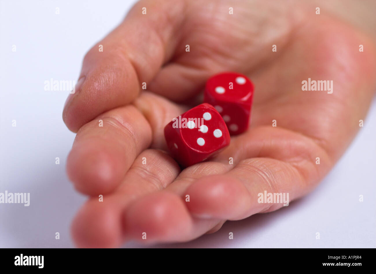 Hand Holding Dice Stock Photo - Alamy