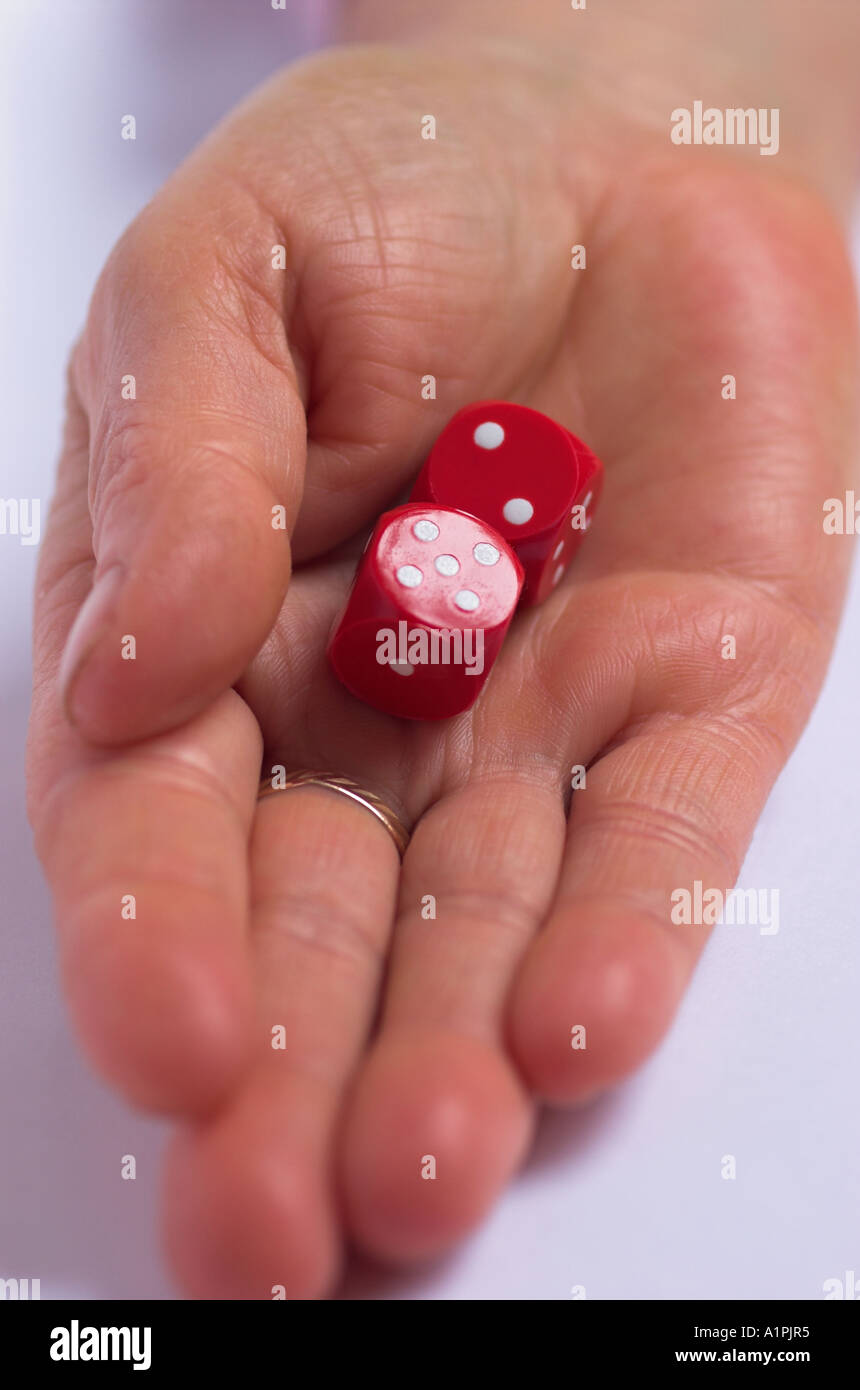 Hand holding pair dice hi-res stock photography and images - Alamy