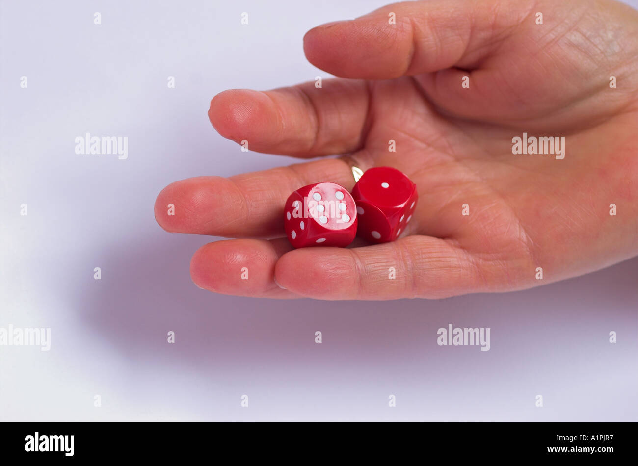 Hand Holding Dice Stock Photo - Alamy