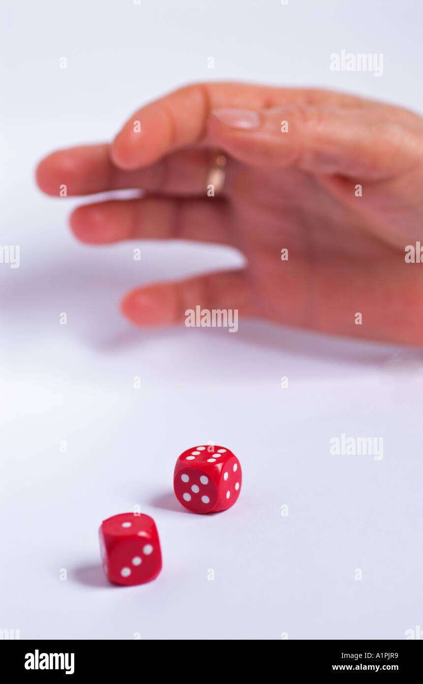 Hand throwing dice Stock Photo - Alamy