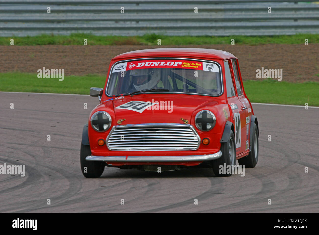 Mini Racing Cars racing around a circuit Stock Photo - Alamy