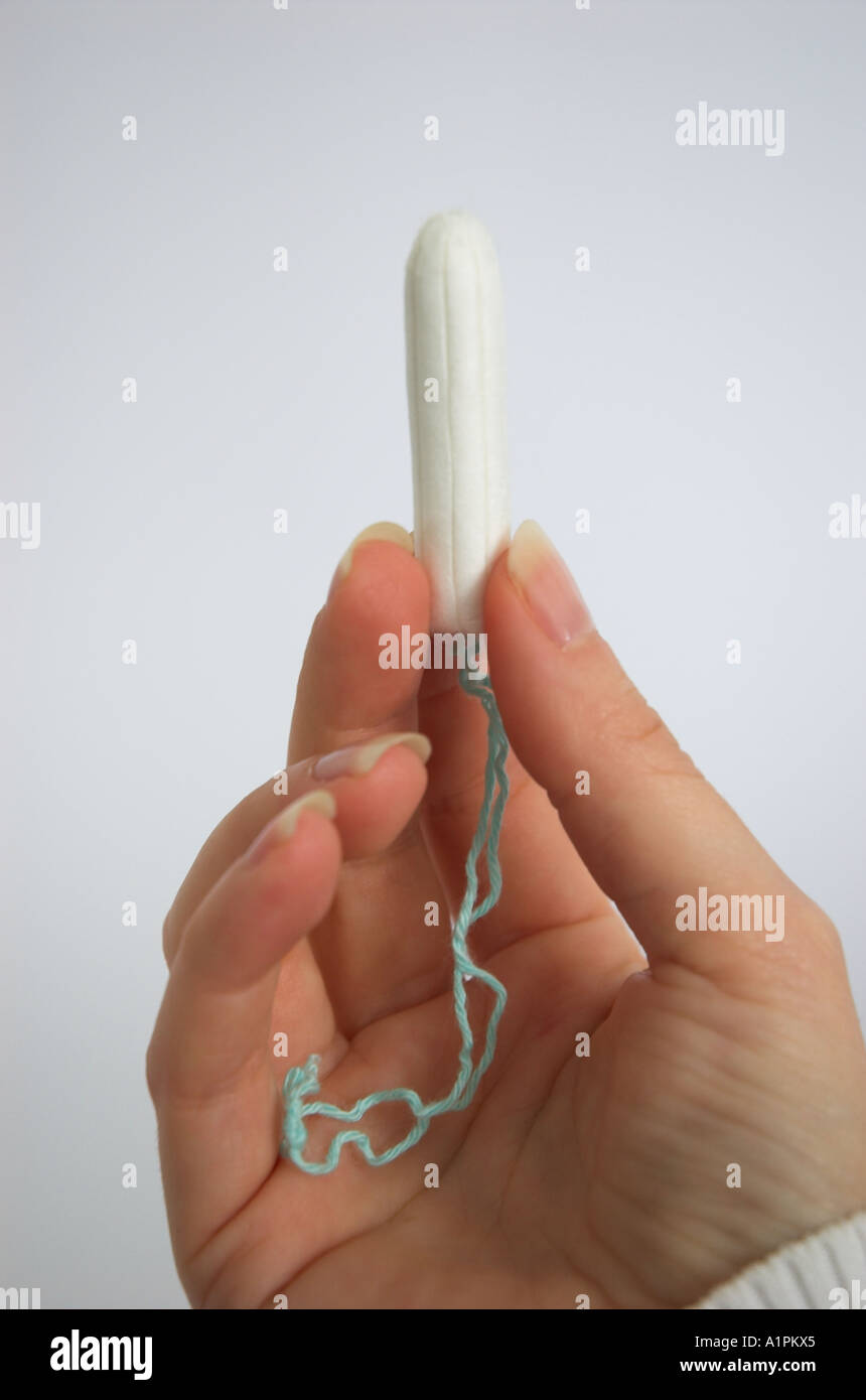 Female hand holding a tampon Stock Photo - Alamy