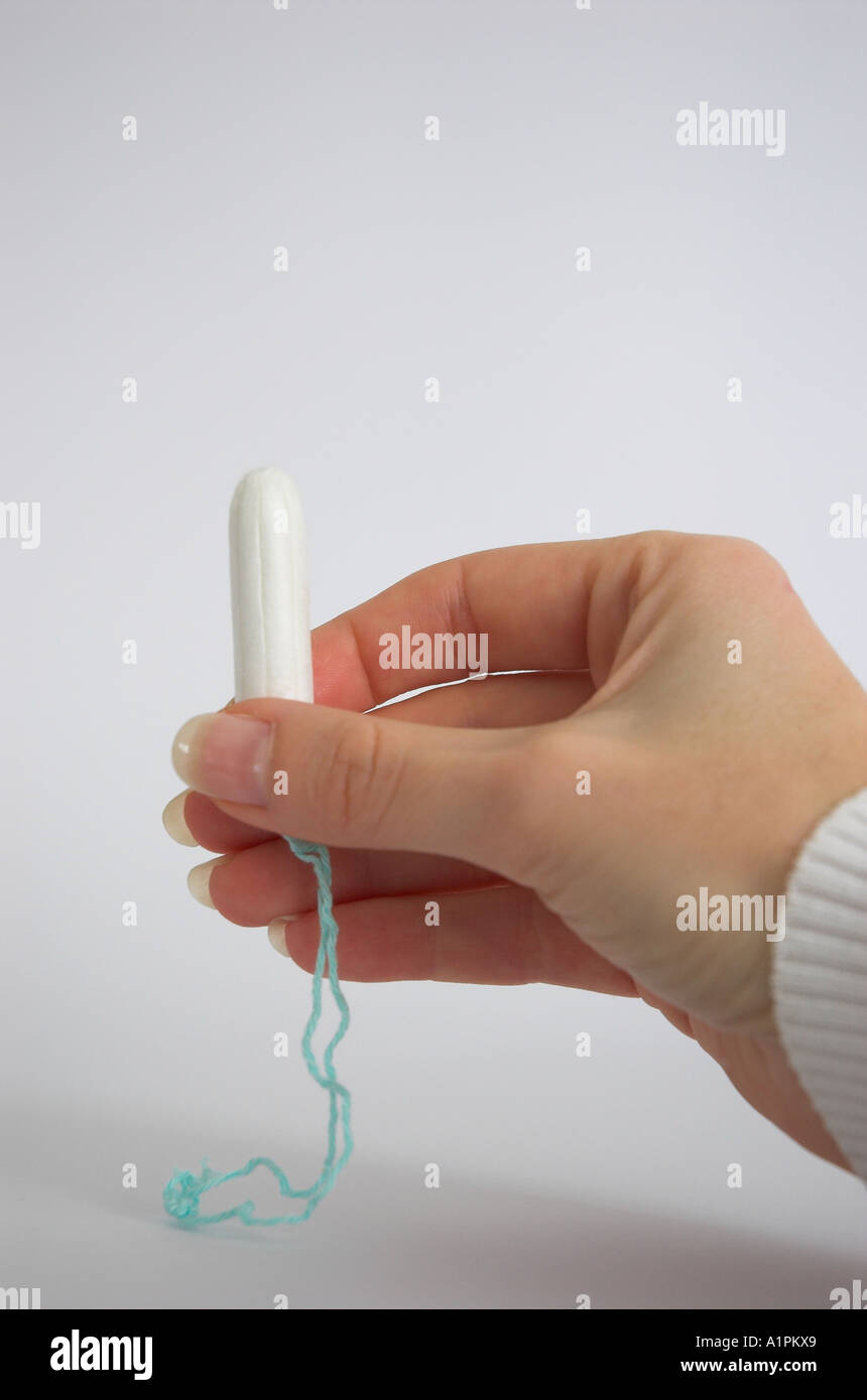 Female hand holding a tampon Stock Photo - Alamy