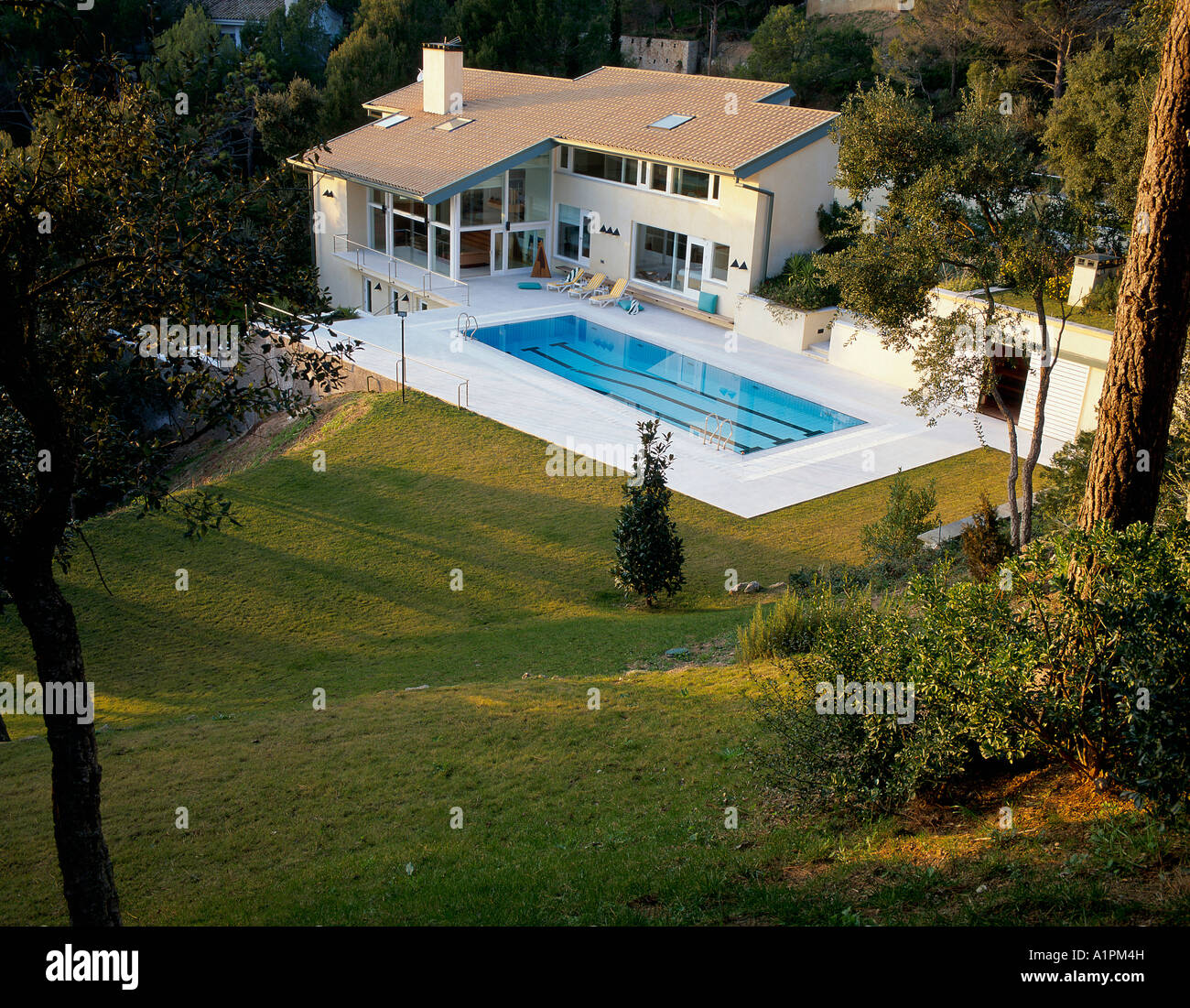 View of a house with an exterior swimming pool Stock Photo - Alamy