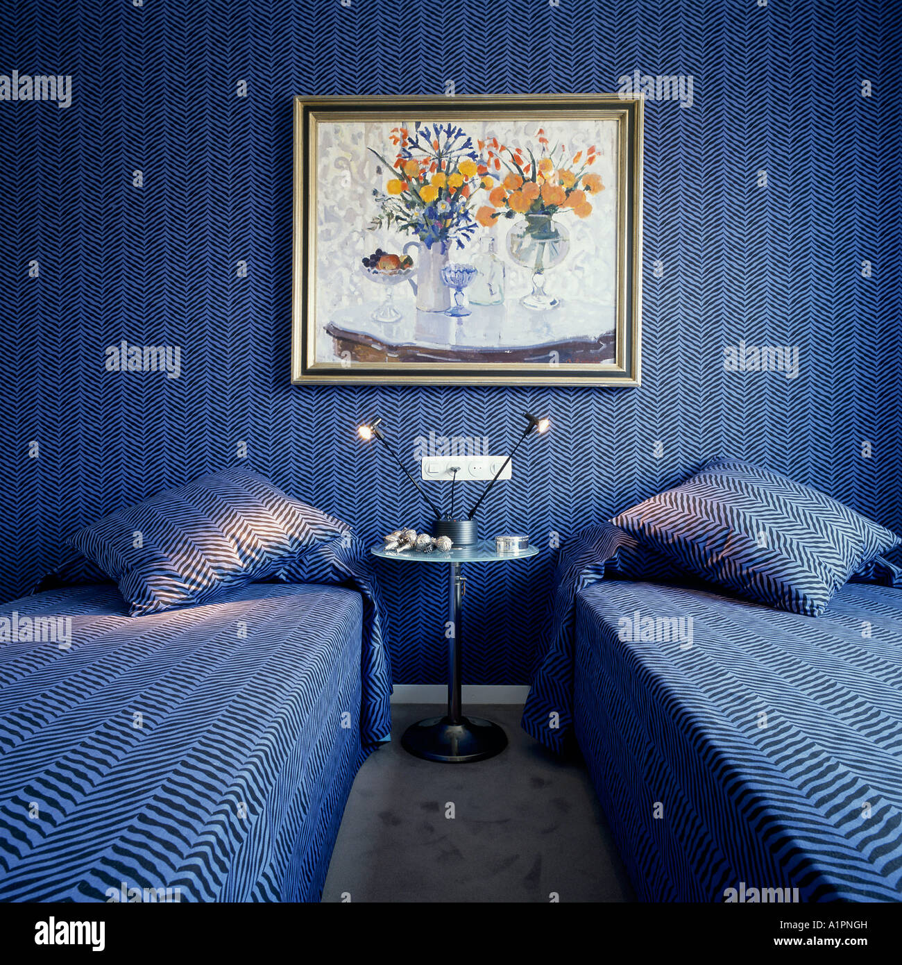 View of two blue colored single beds Stock Photo - Alamy
