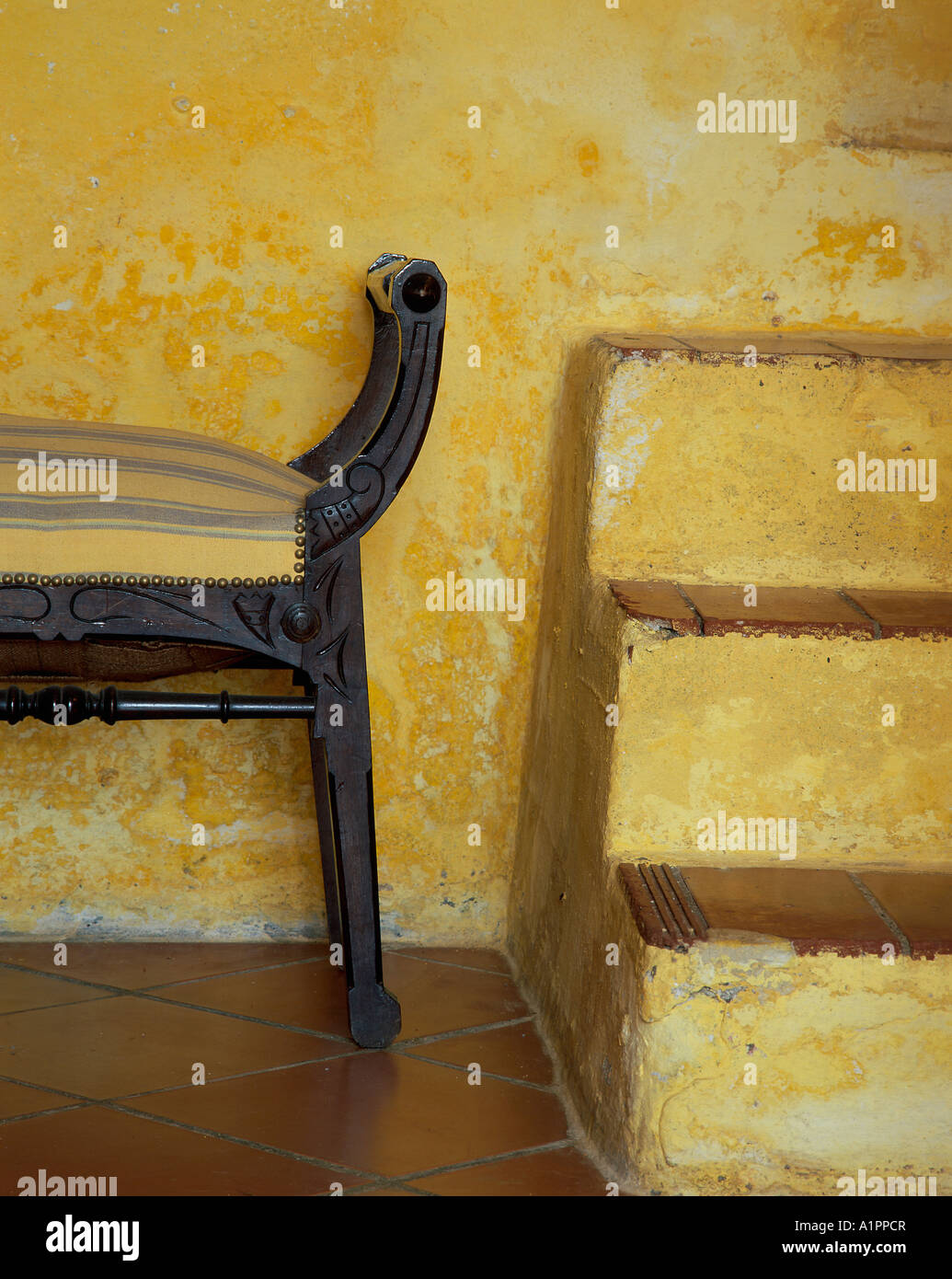 Partial view of a seat near a staircase Stock Photo - Alamy