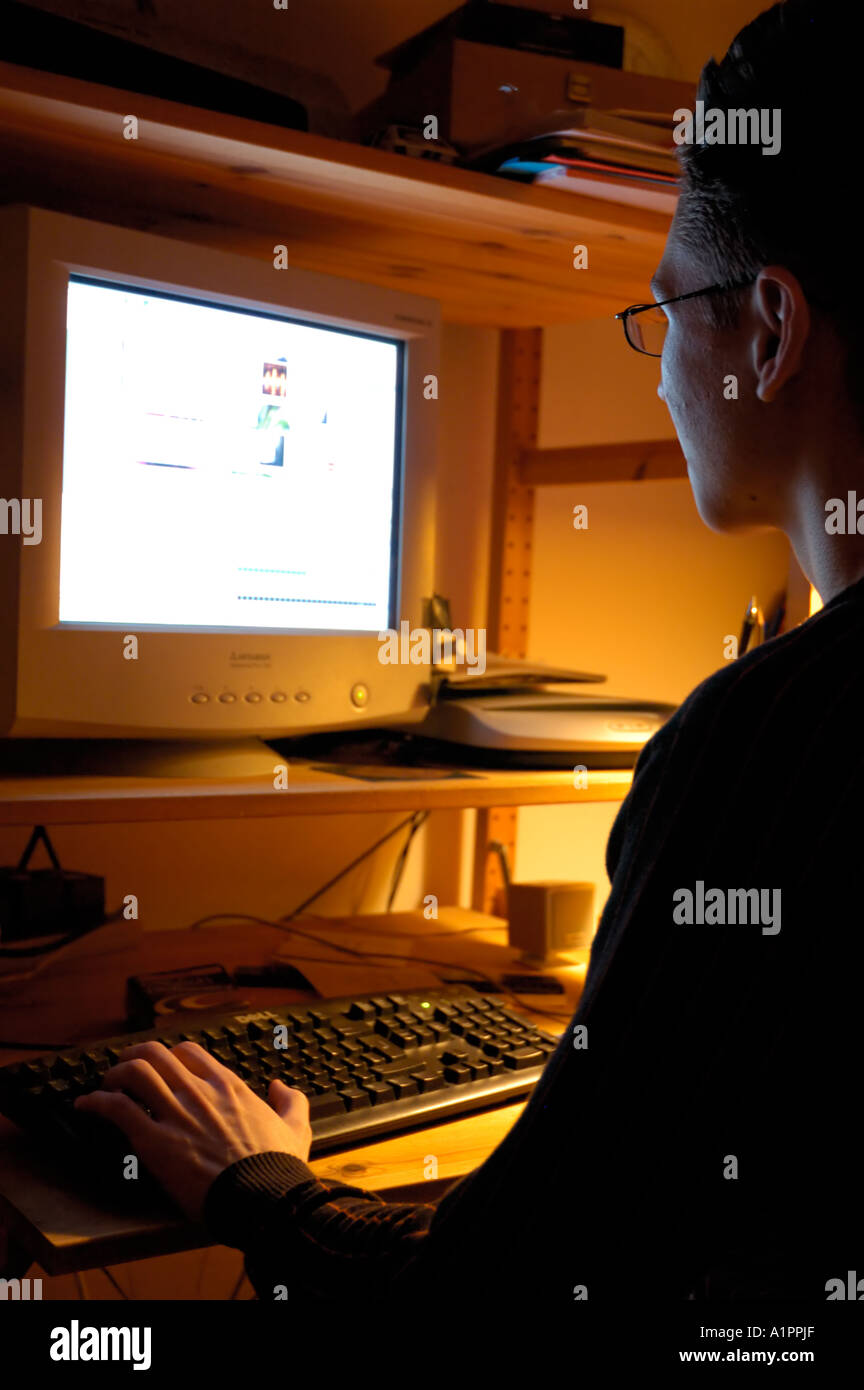 Teenager using computer Stock Photo - Alamy