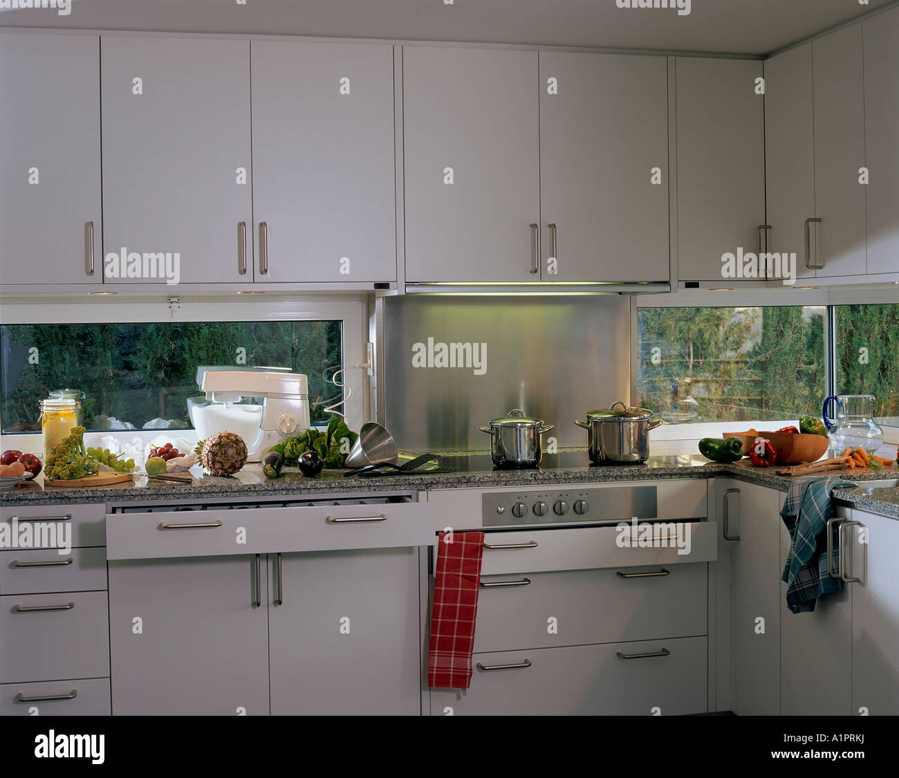View of a kitchen counter full of vegetables Stock Photo - Alamy