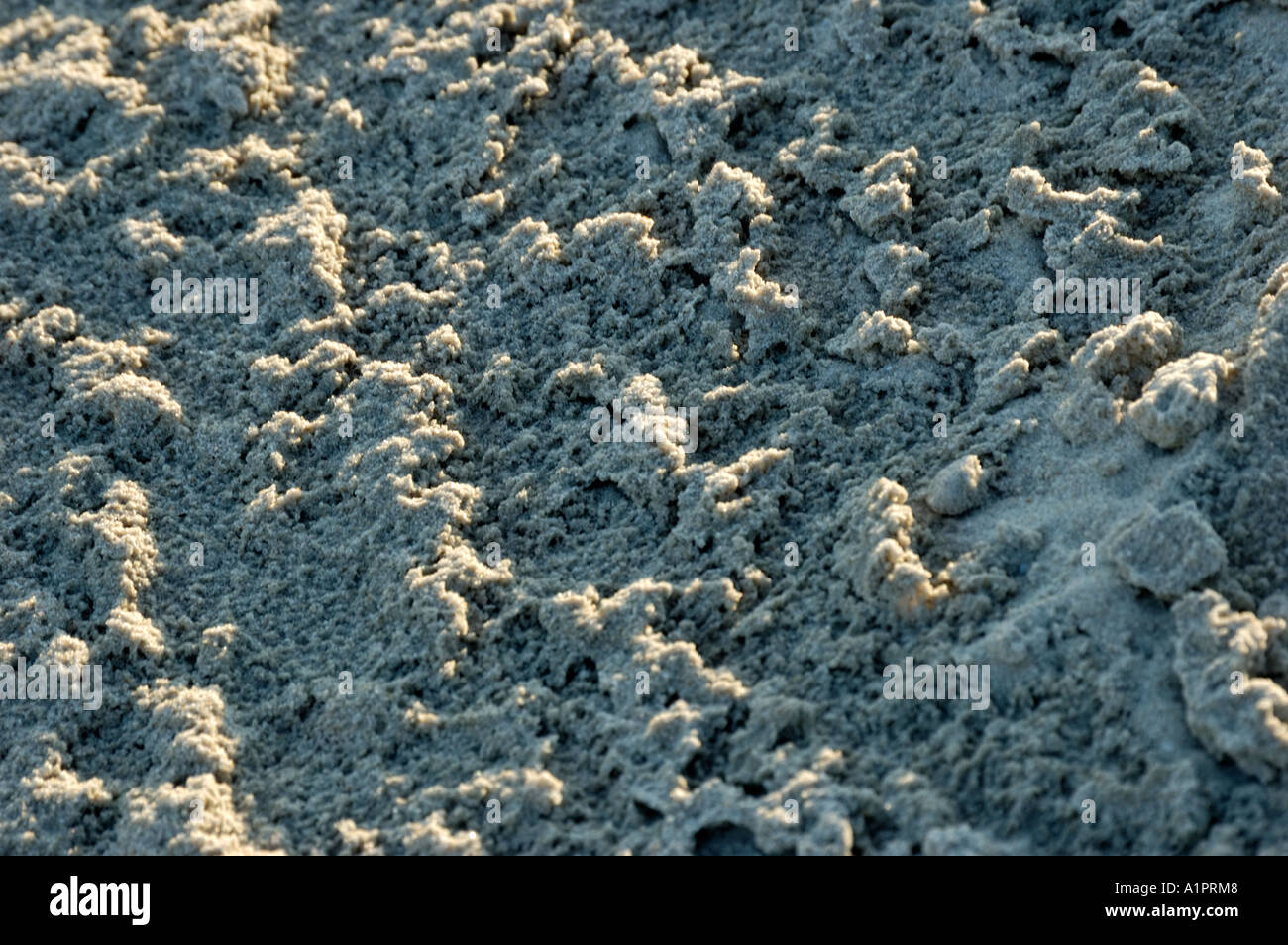 Patterns left in sand after snow has melted Stock Photo - Alamy