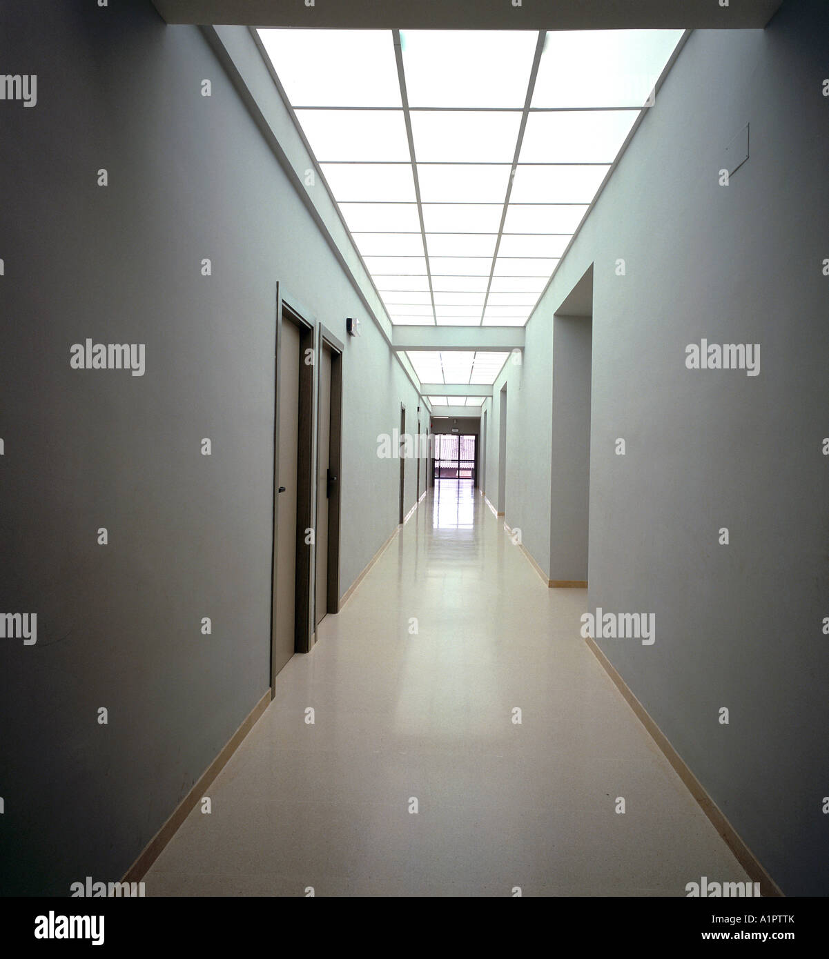 View of an extensive corridor in white tones Stock Photo - Alamy