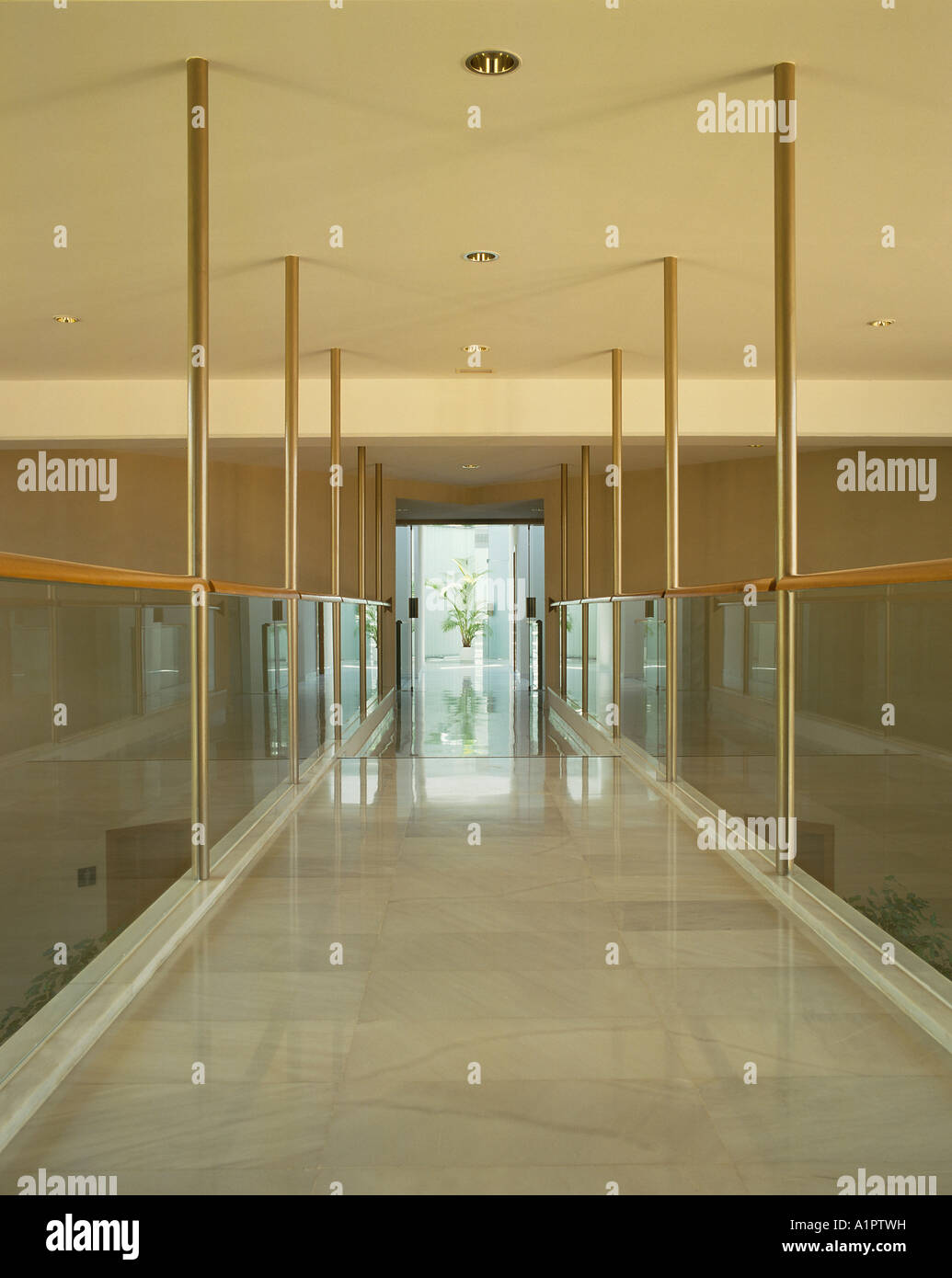 View of a narrow corridor tiled in marble Stock Photo - Alamy