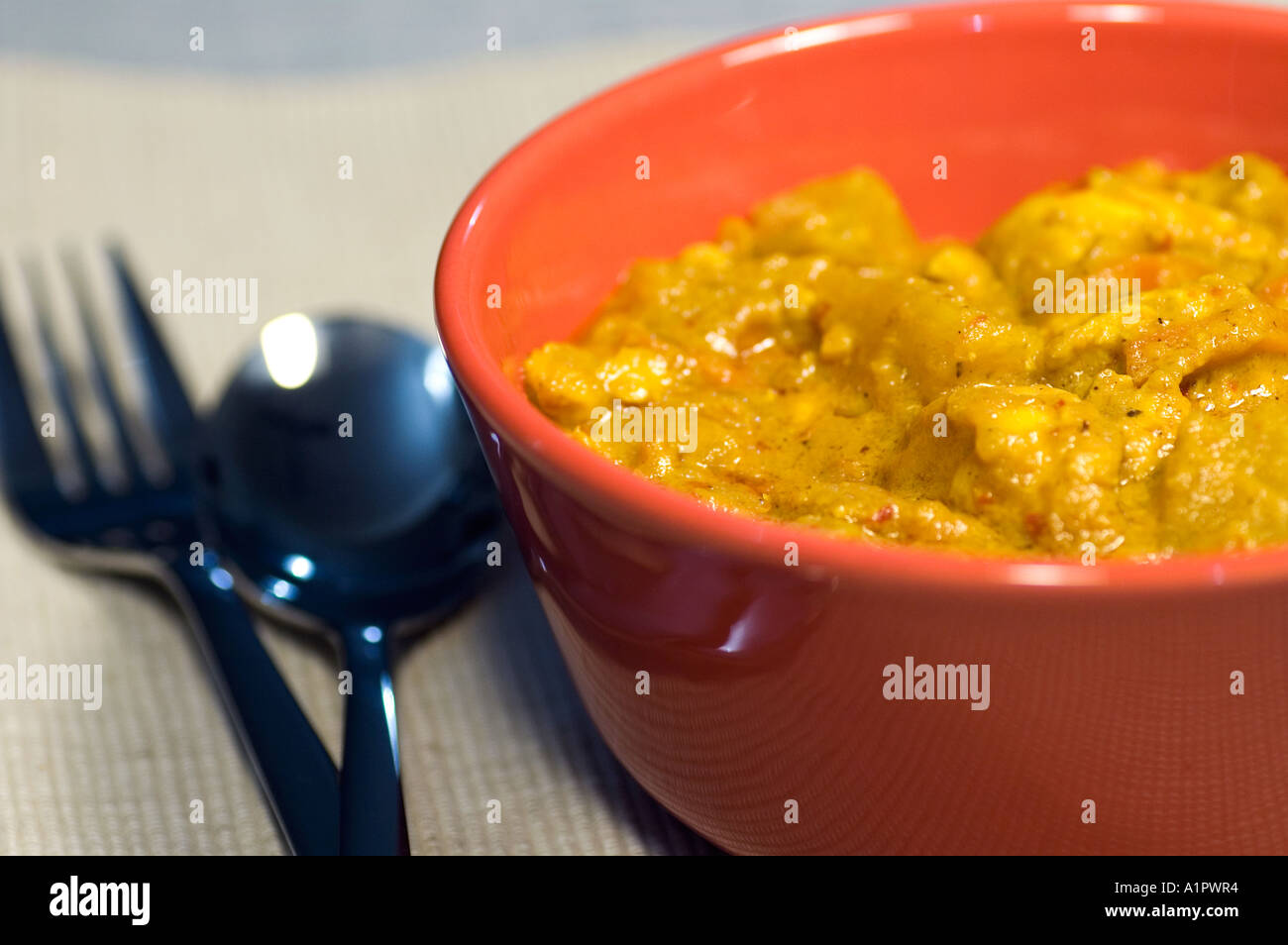 Nyonya Kapitan Curry Chicken with fork and spoon Stock Photo - Alamy