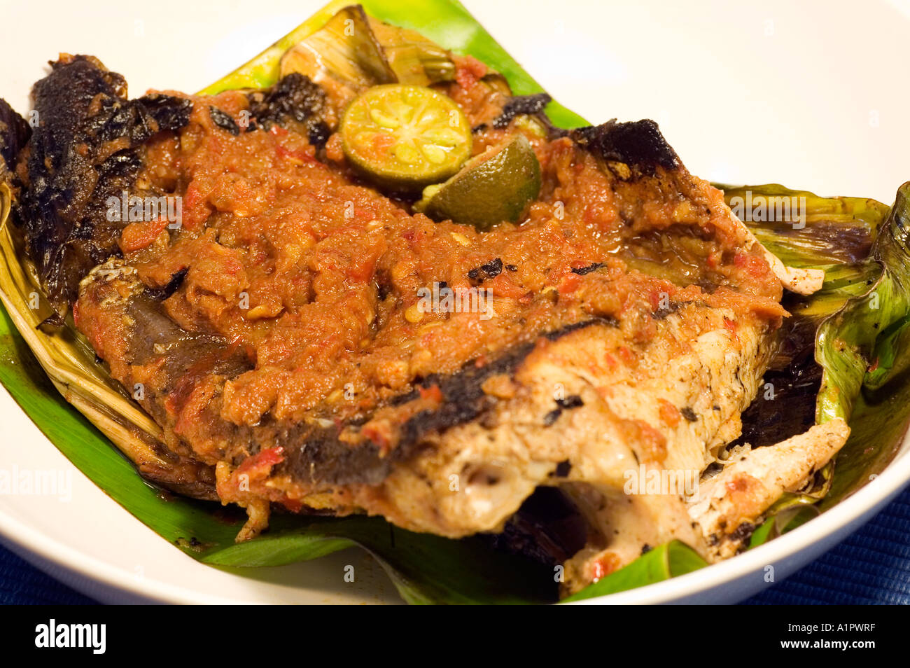 "Ikan Bakar" (grilled sting ray) Malaysian dish Stock Photo - Alamy