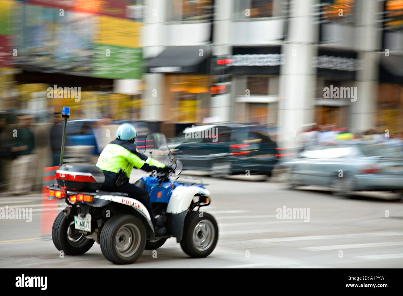 ILLINOIS Chicago Police officer ride ATV vehicle on city street blur of ...