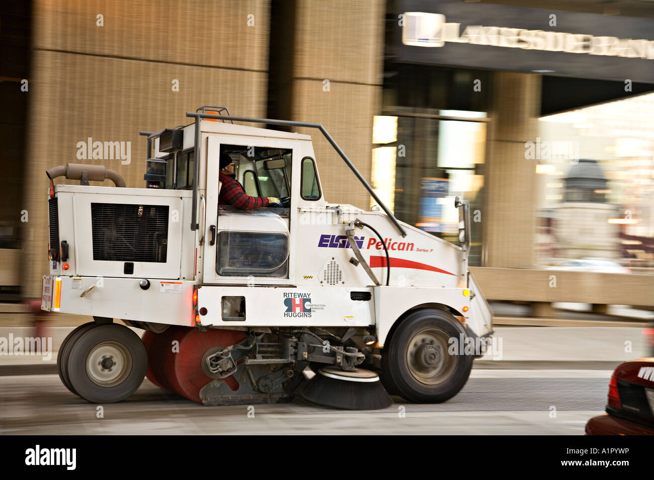 ILLINOIS Chicago Street sweeper cleaning city street white brushes ...