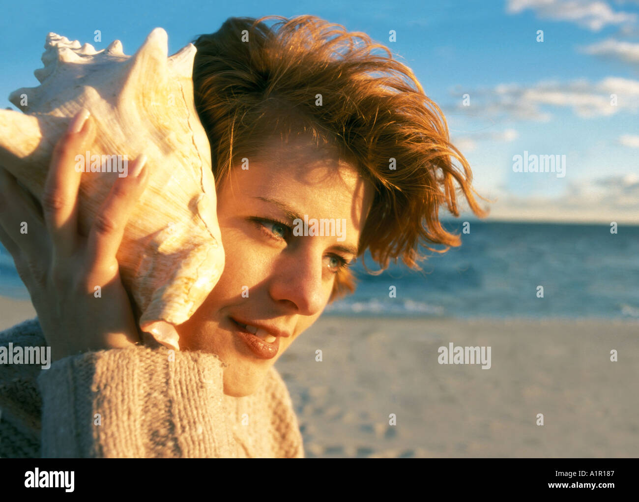 Listen seashell hi-res stock photography and images - Alamy