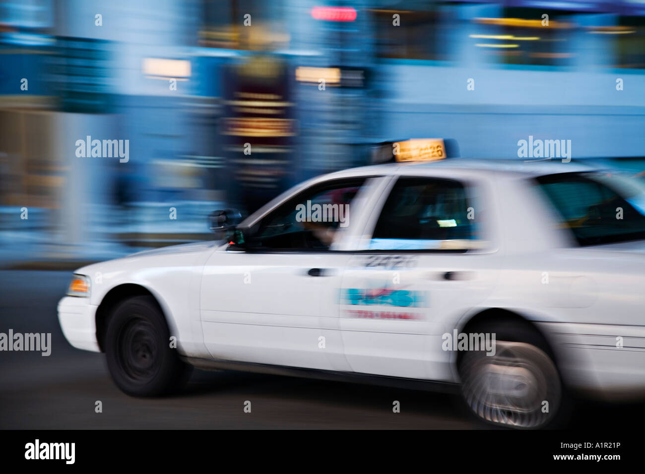 ILLINOIS Chicago White taxi cab at night on city street,blurred motion ...