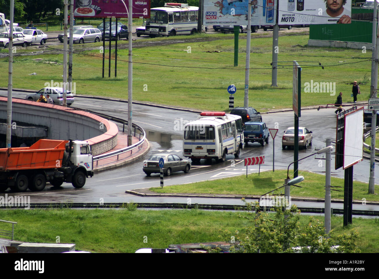 Vehicles navigate a busy roundabout in Kyiv, showcasing the city's ...