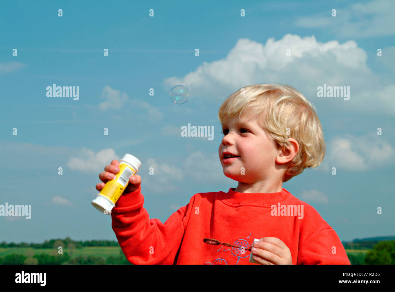 little boy making soap bubbles MR Stock Photo - Alamy