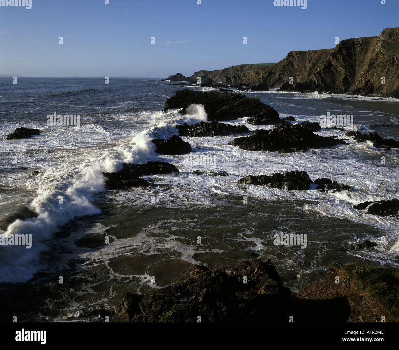 Waves breaking on the rocks at Hartland Quay on the North Devon Coast ...