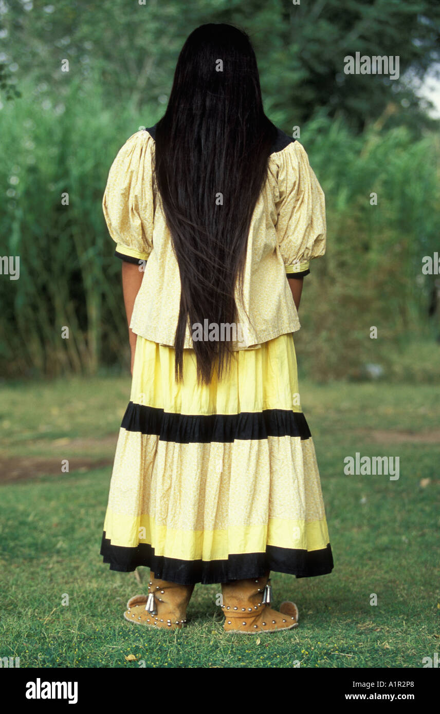 A portrait from behind of an Apache girl with long hair in Bylas the ...