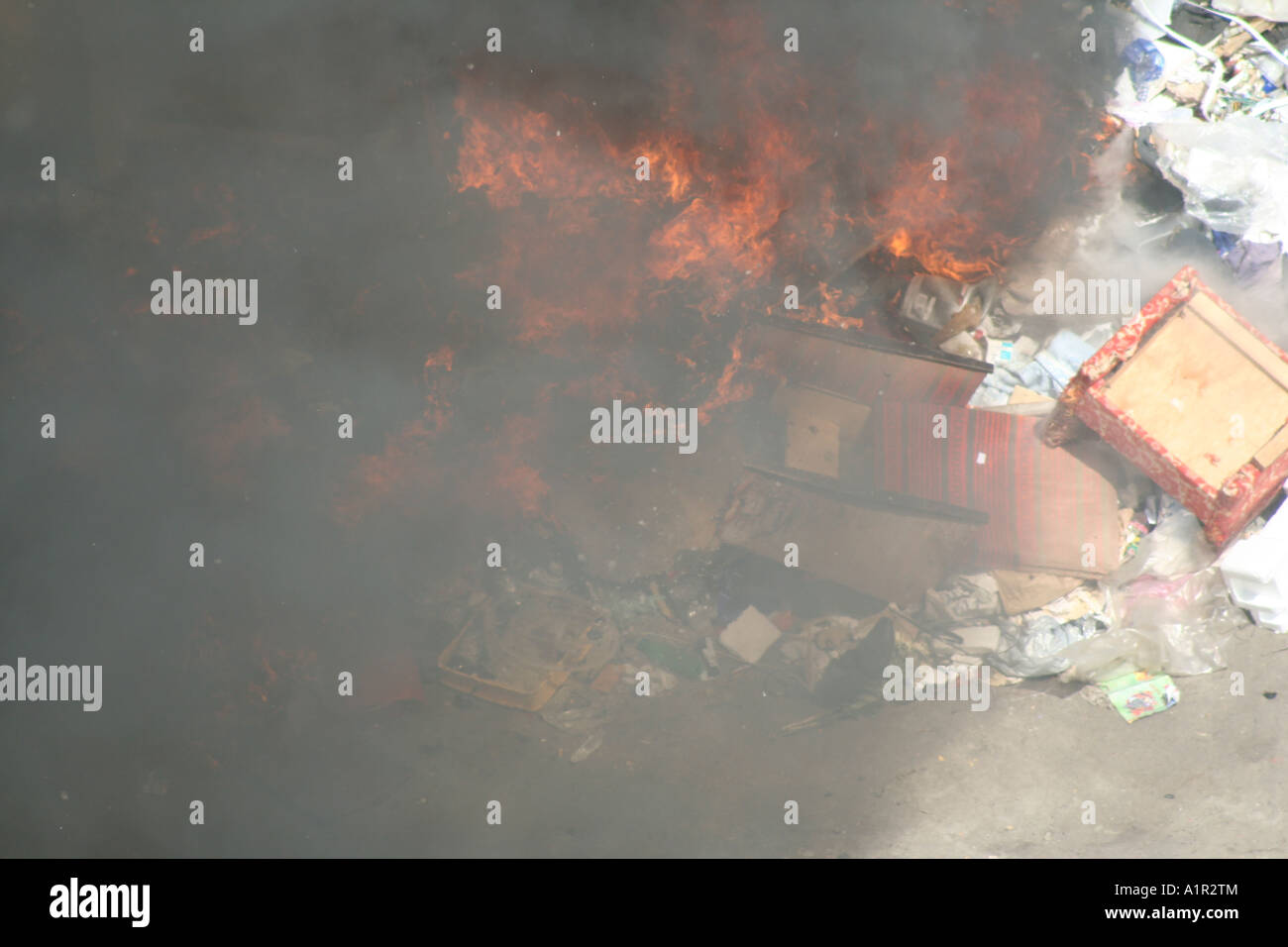 Burning trash and debris causing pollution and smoke Stock Photo - Alamy