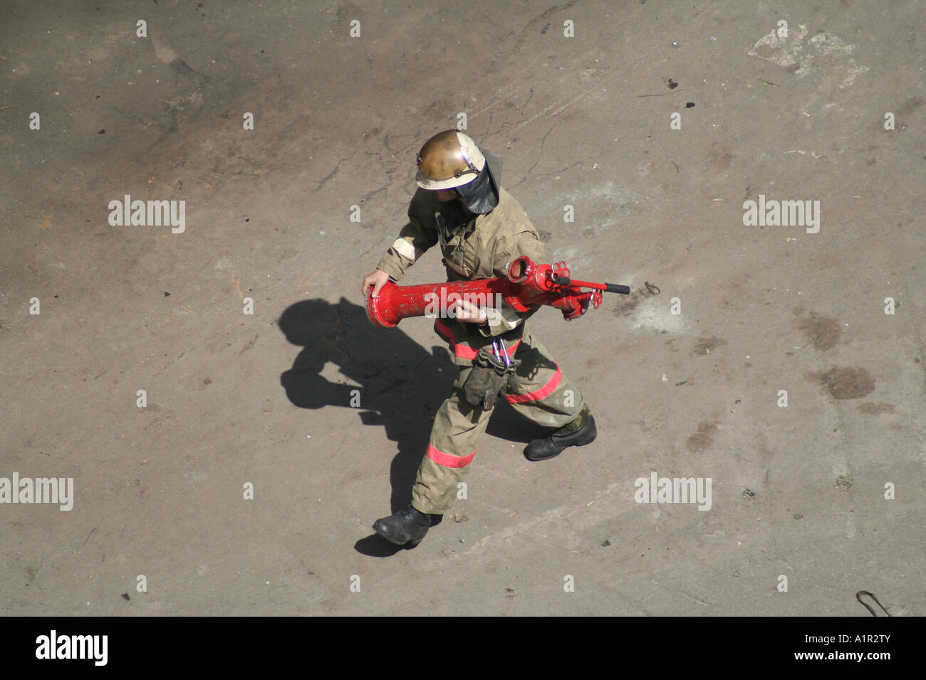 Firefighter in Kyiv carrying equipment during an emergency response ...