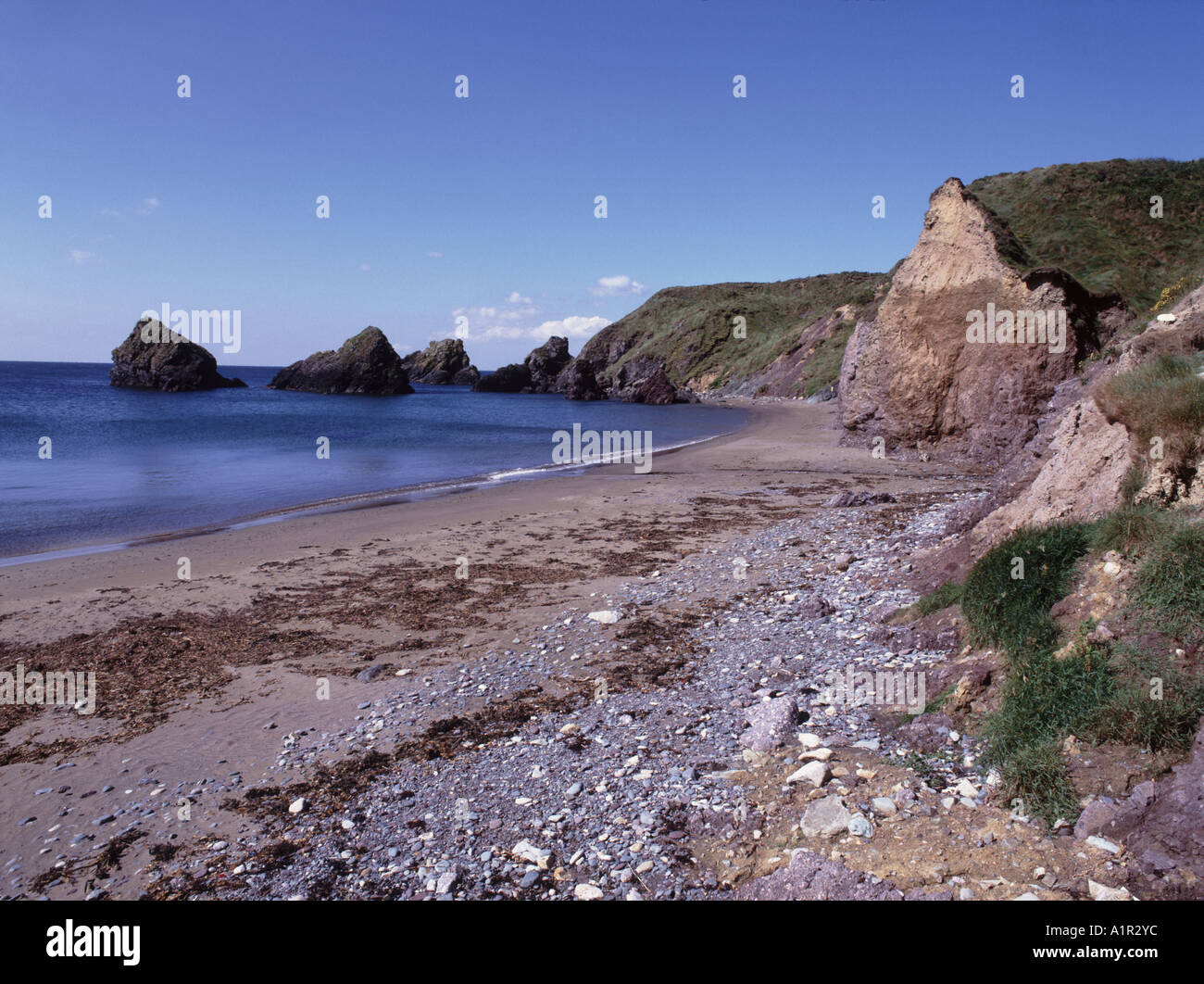 A quiet beach below the cliff's near Knockmahon on Ireland's Copper ...