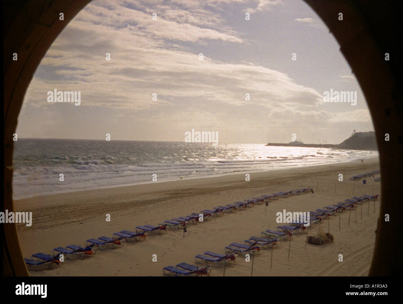 View of sea shore through circular window of lifeguard post Puerto del ...