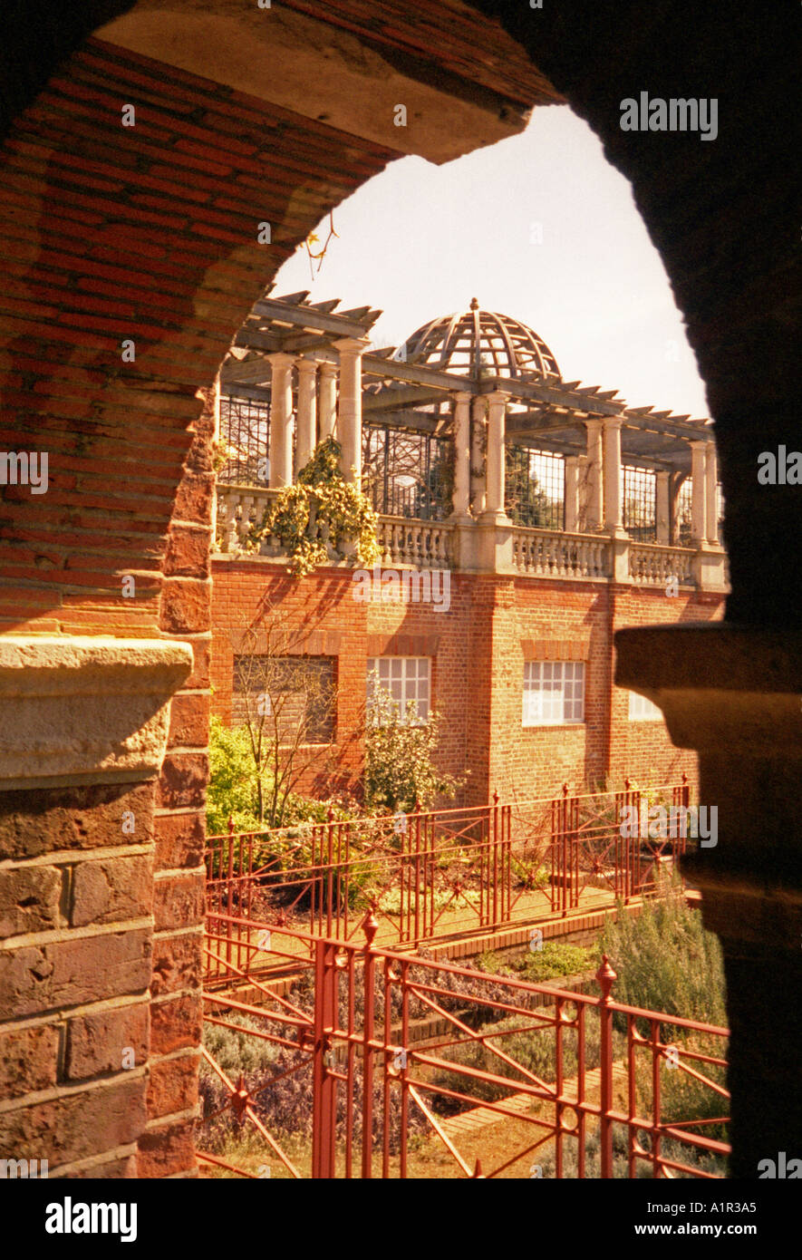 Side view of the red bricks pergola & Georgian colonnade through an ...