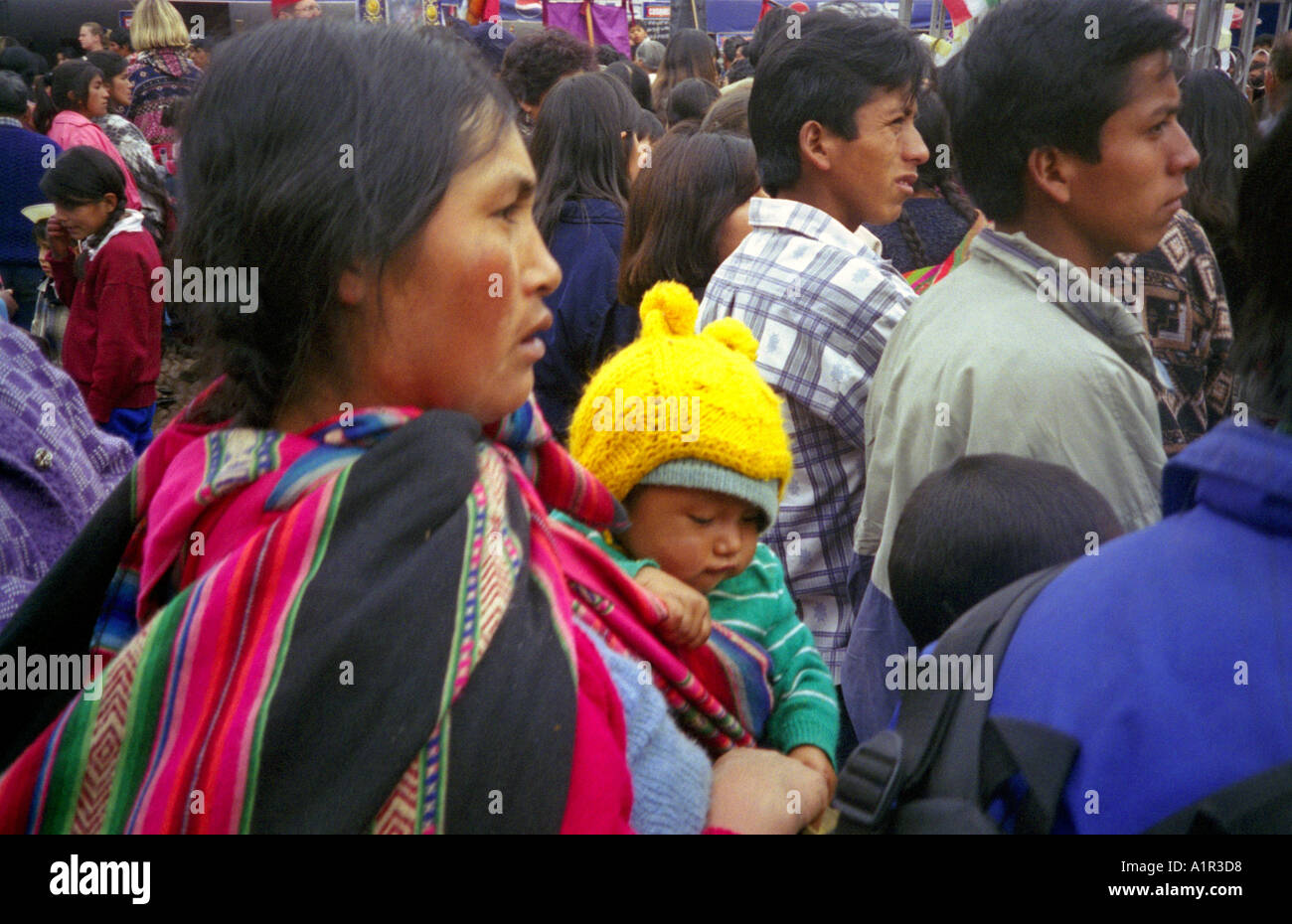 Portrait group indigenous women gather carry baby hug shoulder outdoor ...