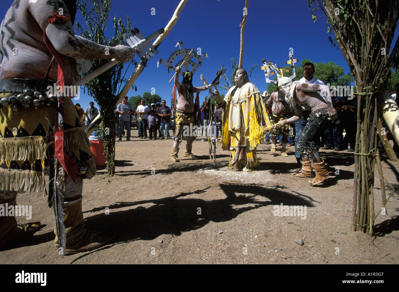 An Apache girl is painted with sacred clay and corn meal during her ...
