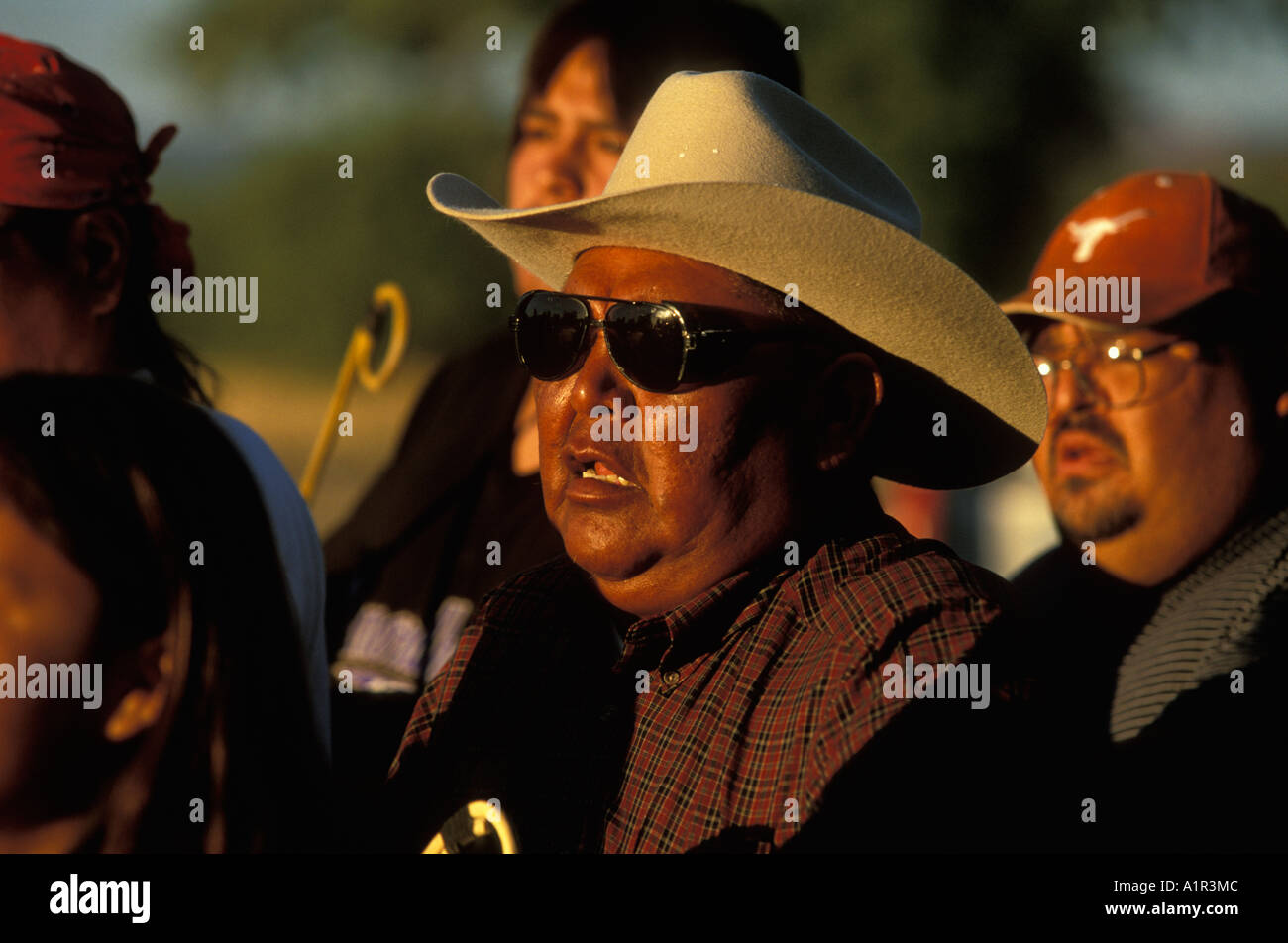 An Apache medicine man sings and beats his drum at a Sunrise Dance on ...