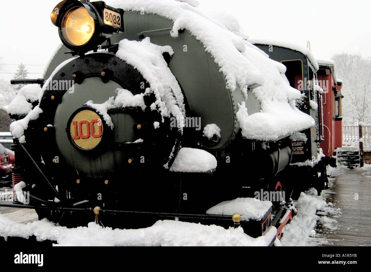 Old snow covered steam locomotive Stock Photo - Alamy
