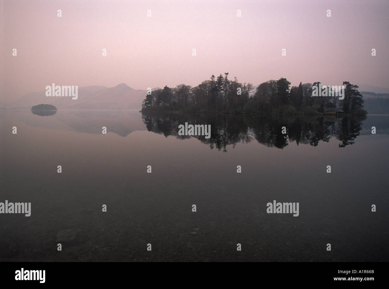 Early morning mist on Derwentwater near Keswick Cumbria Lake District ...