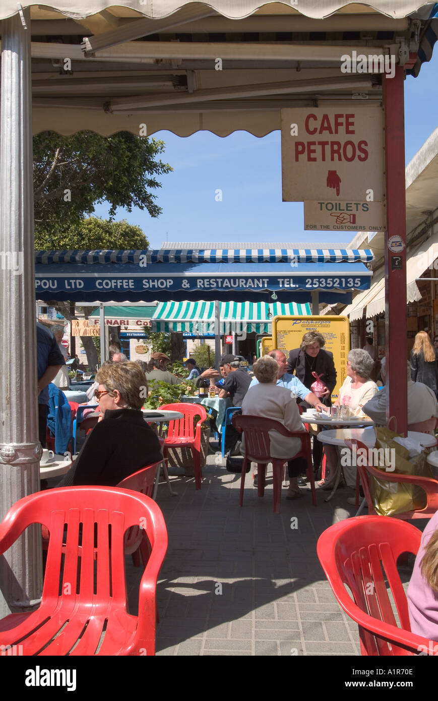 Typical street cafe in Limassol Cyprus with tourists enjoying a break ...