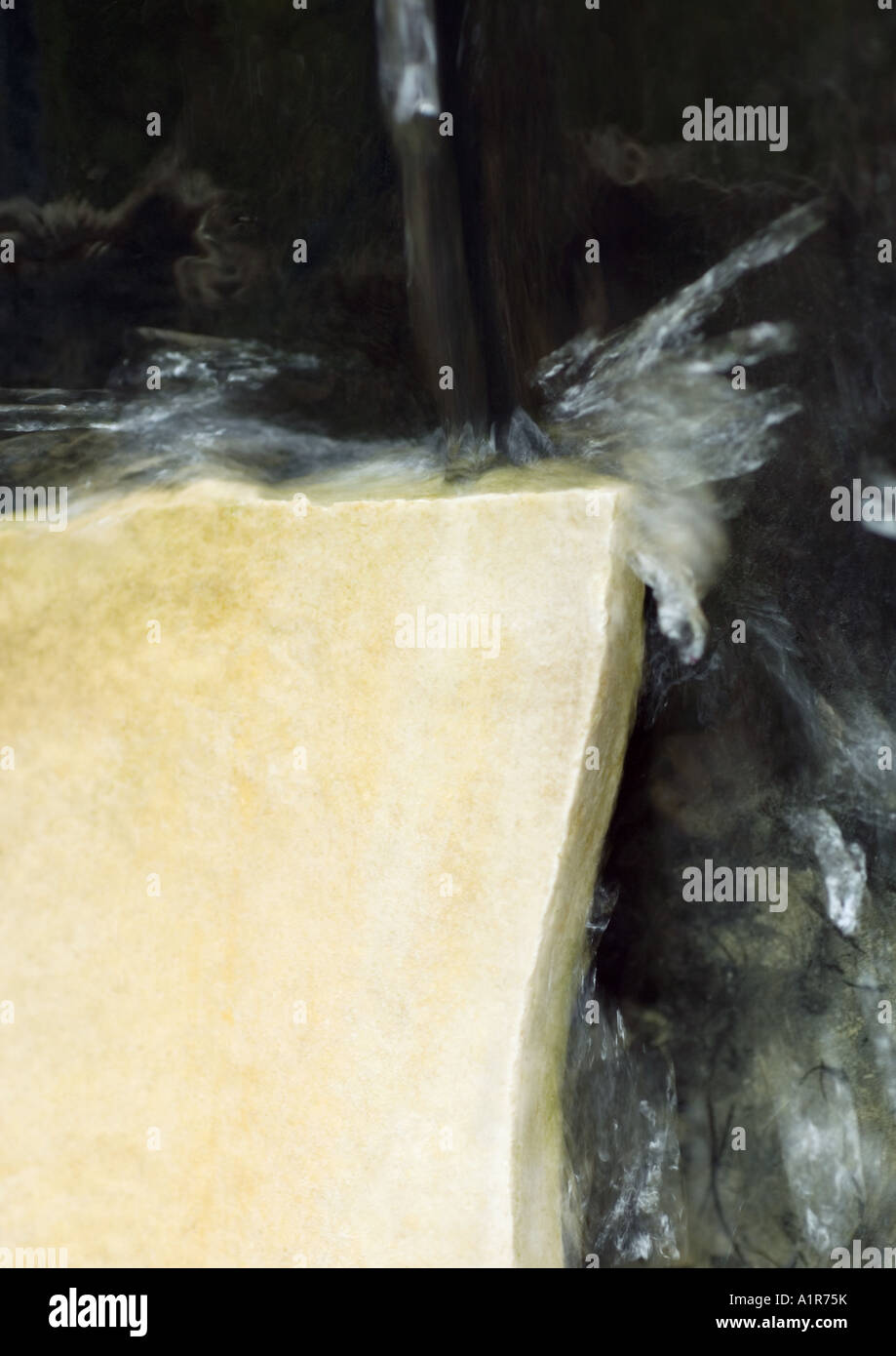 Water flowing onto stone surface Stock Photo - Alamy